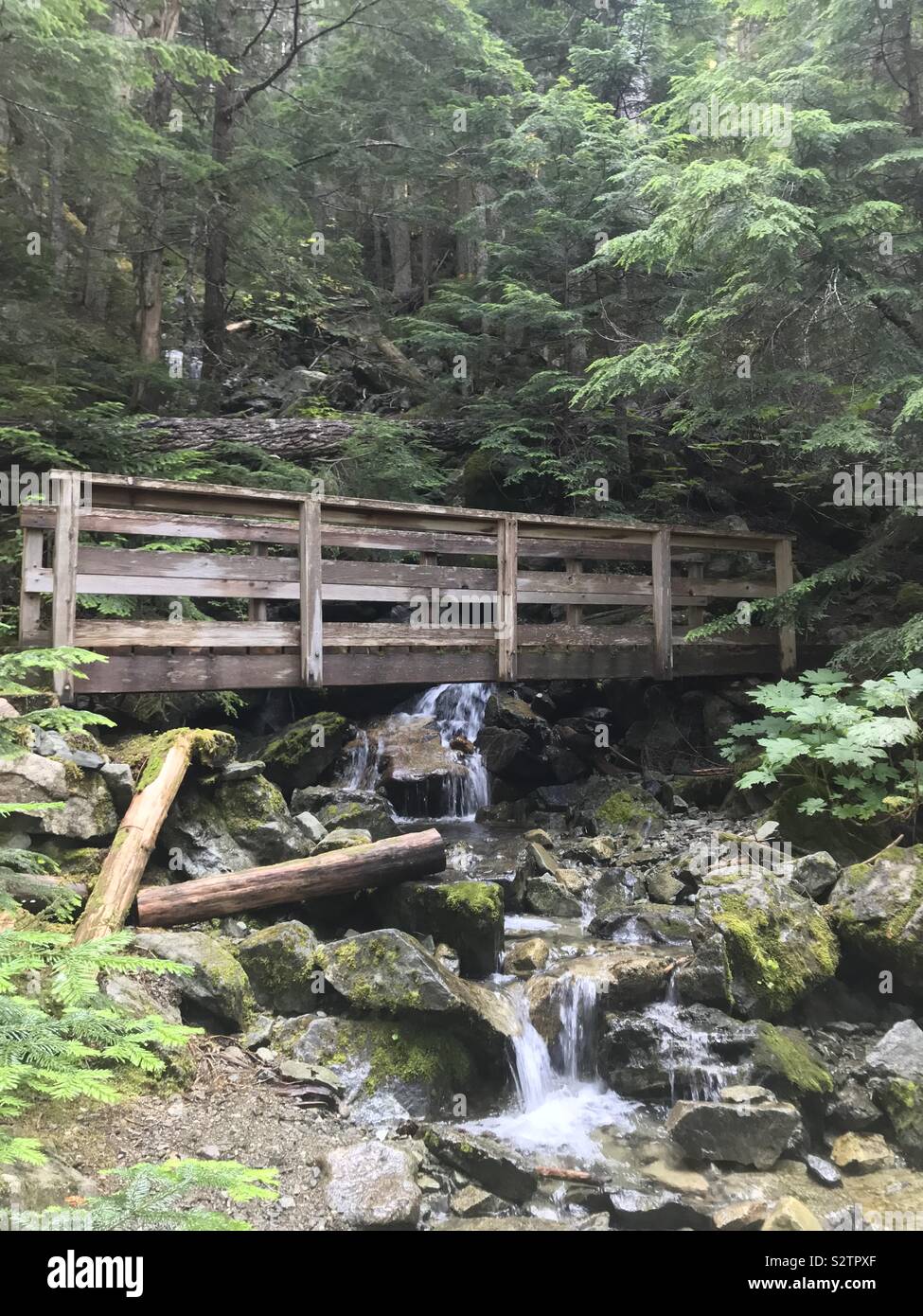 Bridge over water falling Stock Photo - Alamy