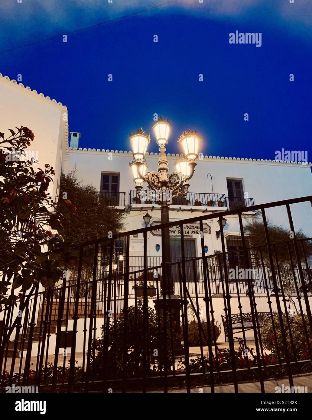 Lamppost lit up in Spain Stock Photo - Alamy