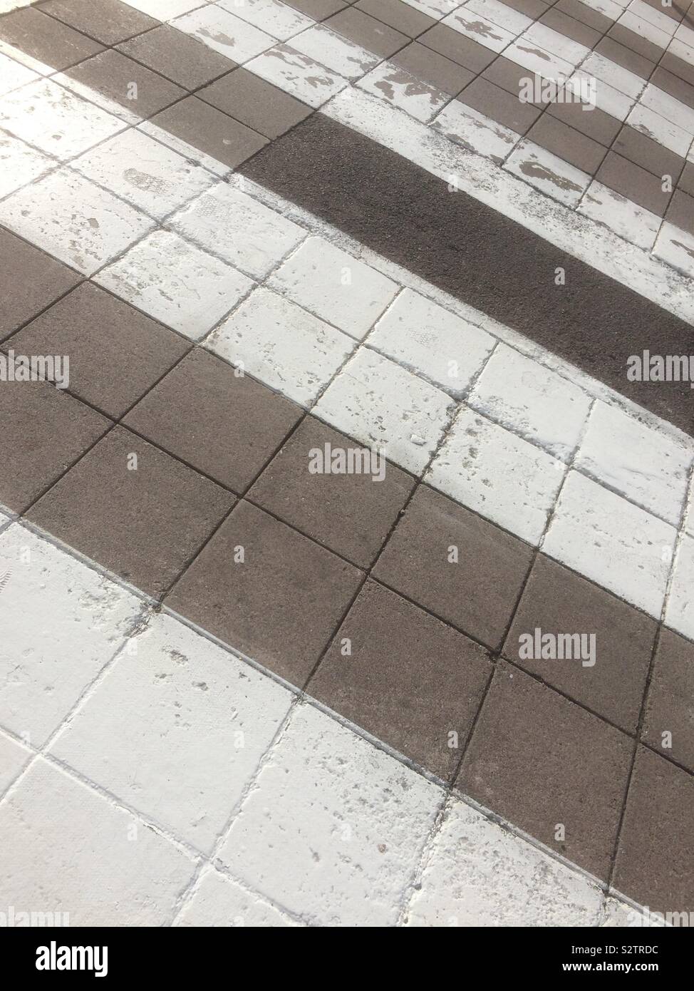 Detail of cross walking white stripes in diagonal angle Stock Photo - Alamy