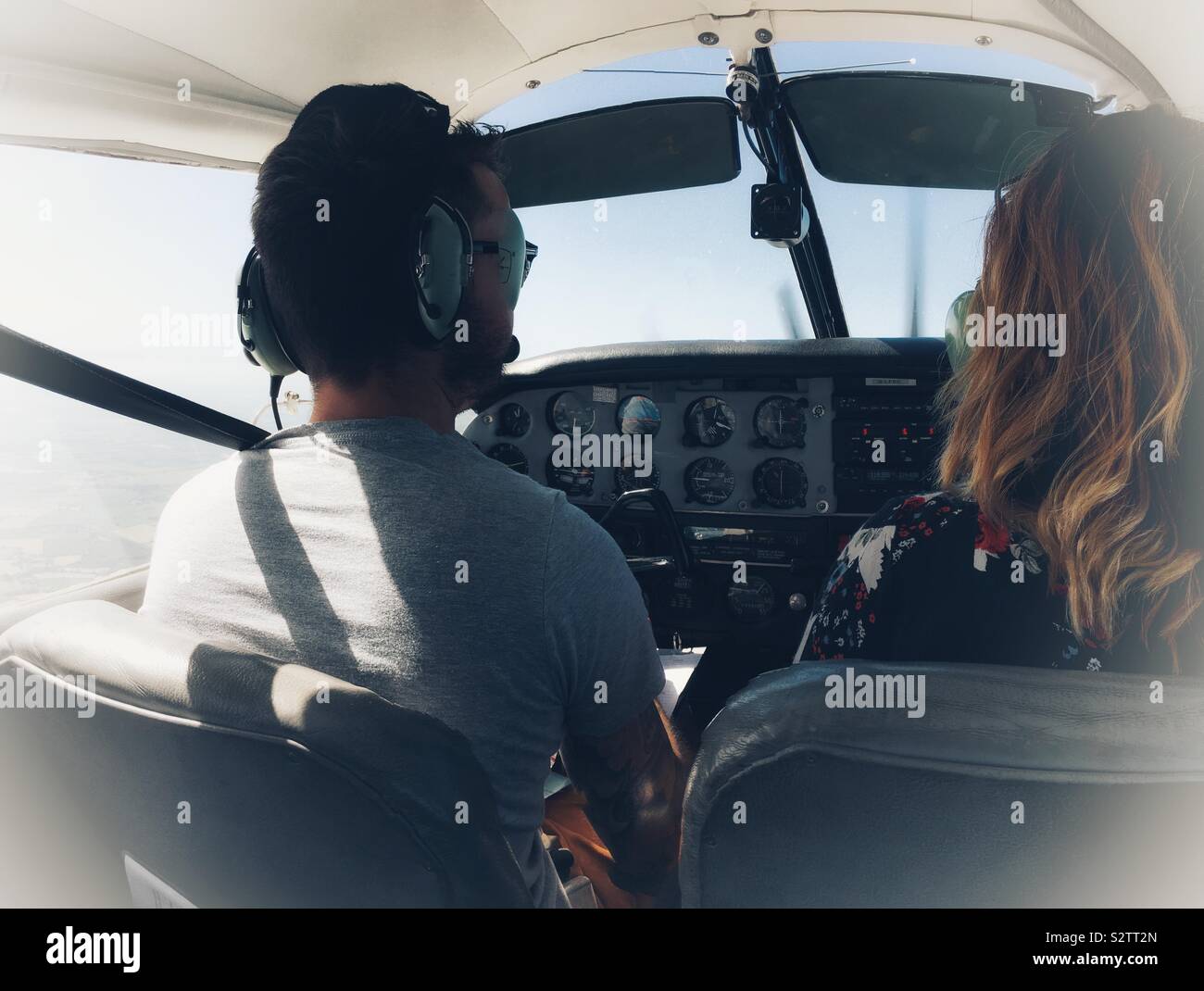 Pilot and passenger in light aircraft Stock Photo - Alamy