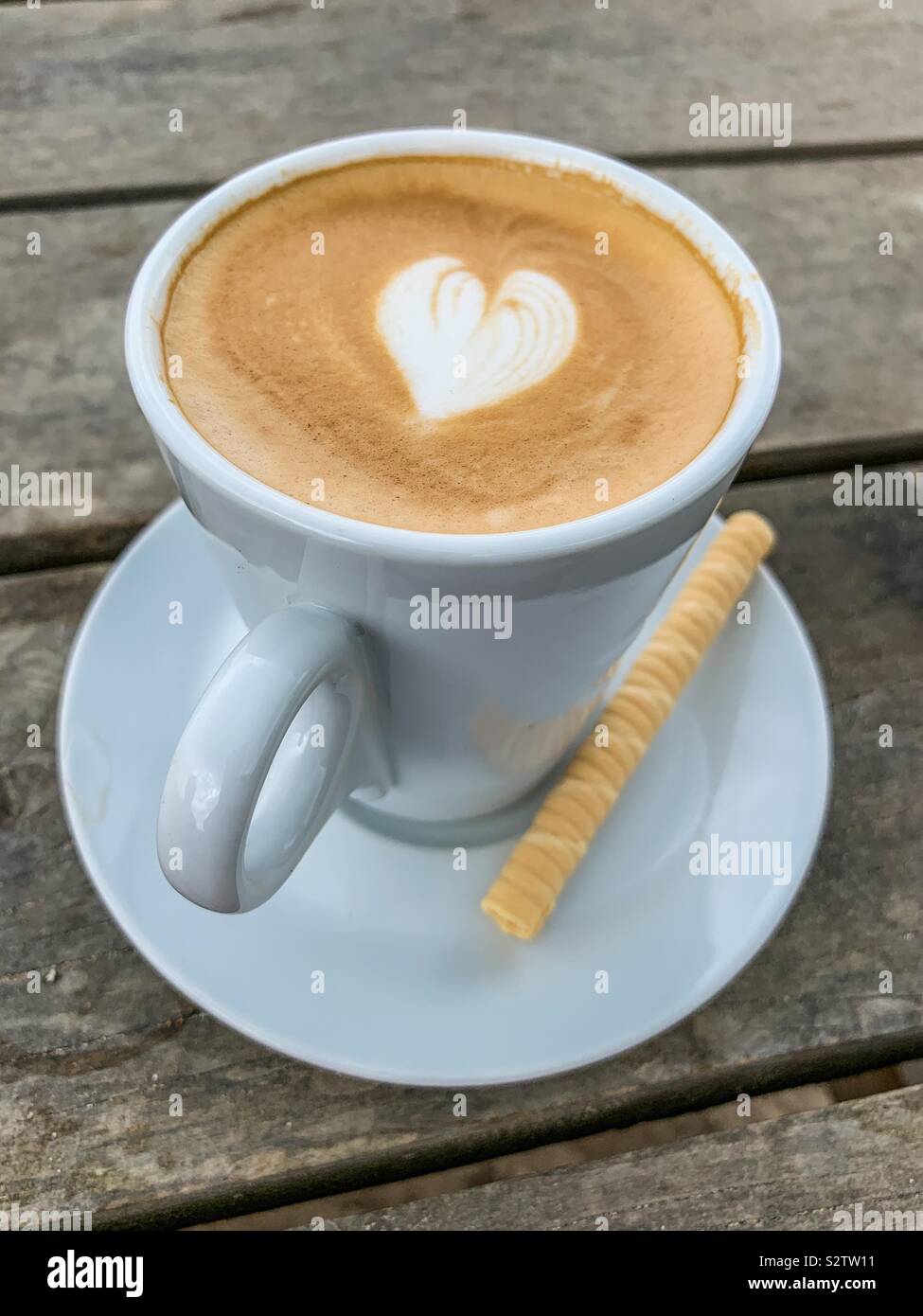 Cup of latte coffee with a love heart Stock Photo - Alamy
