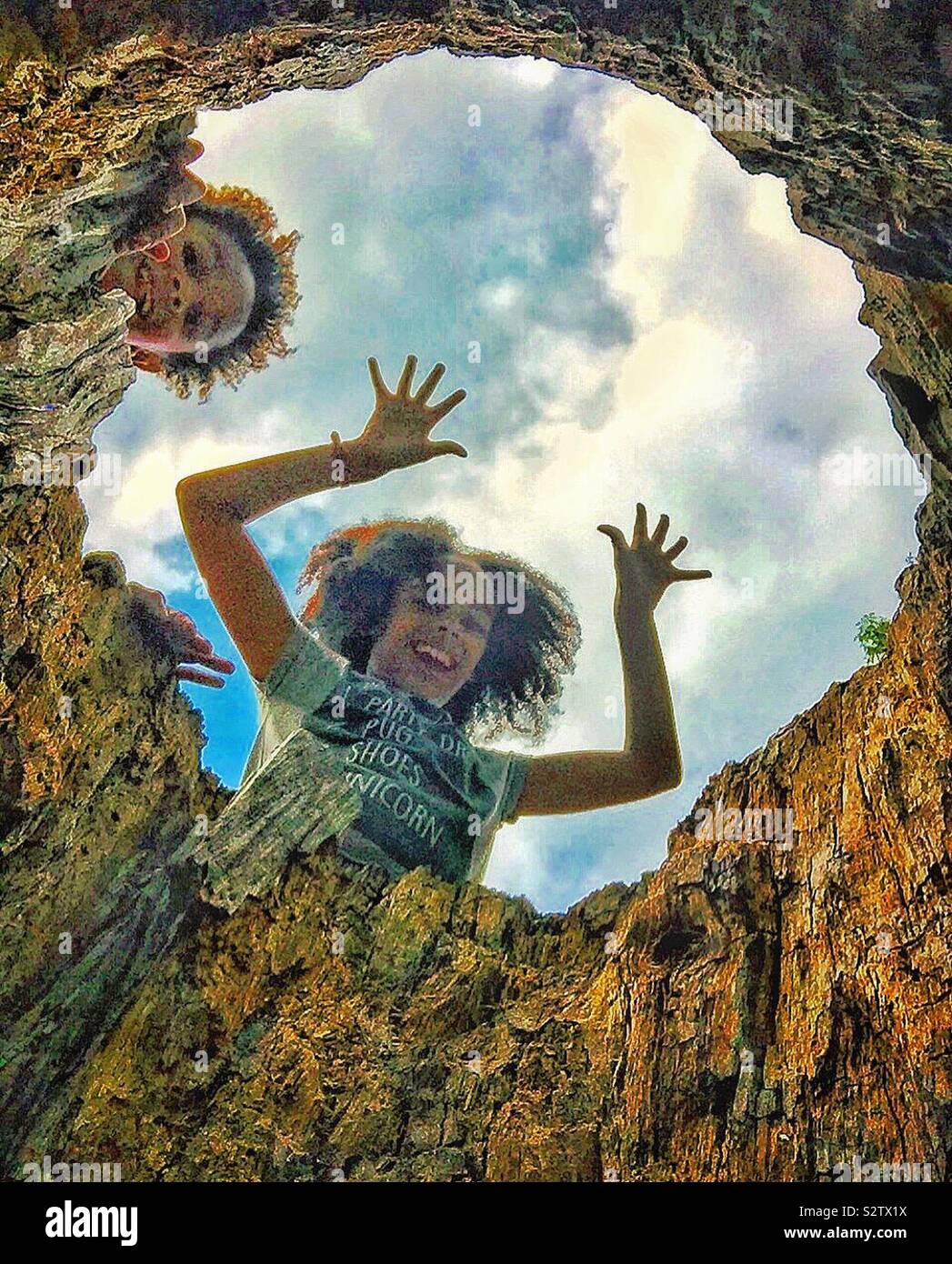 Children playing on a tree stump Stock Photo - Alamy