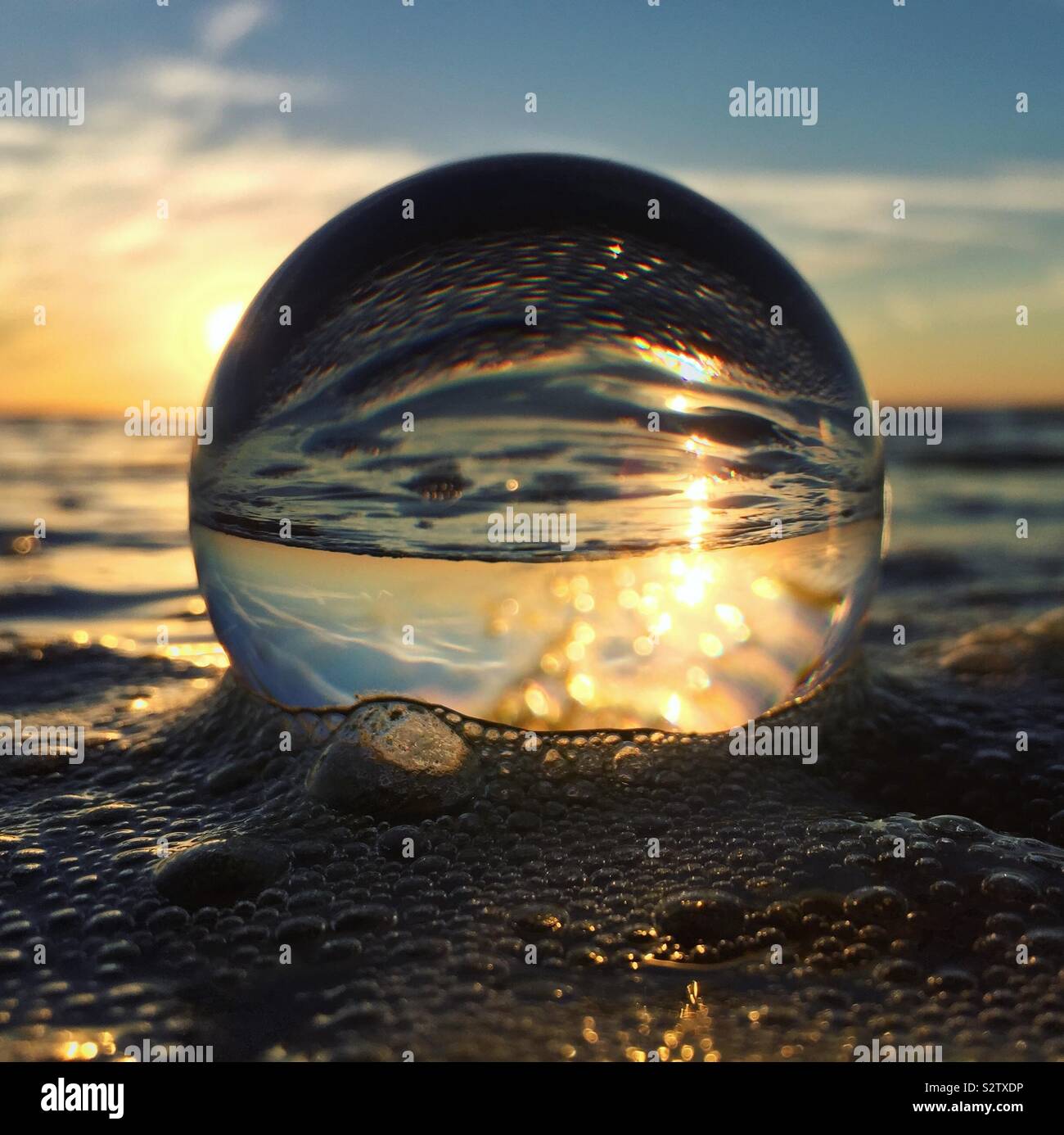 Sunset, high tide, another world Stock Photo - Alamy