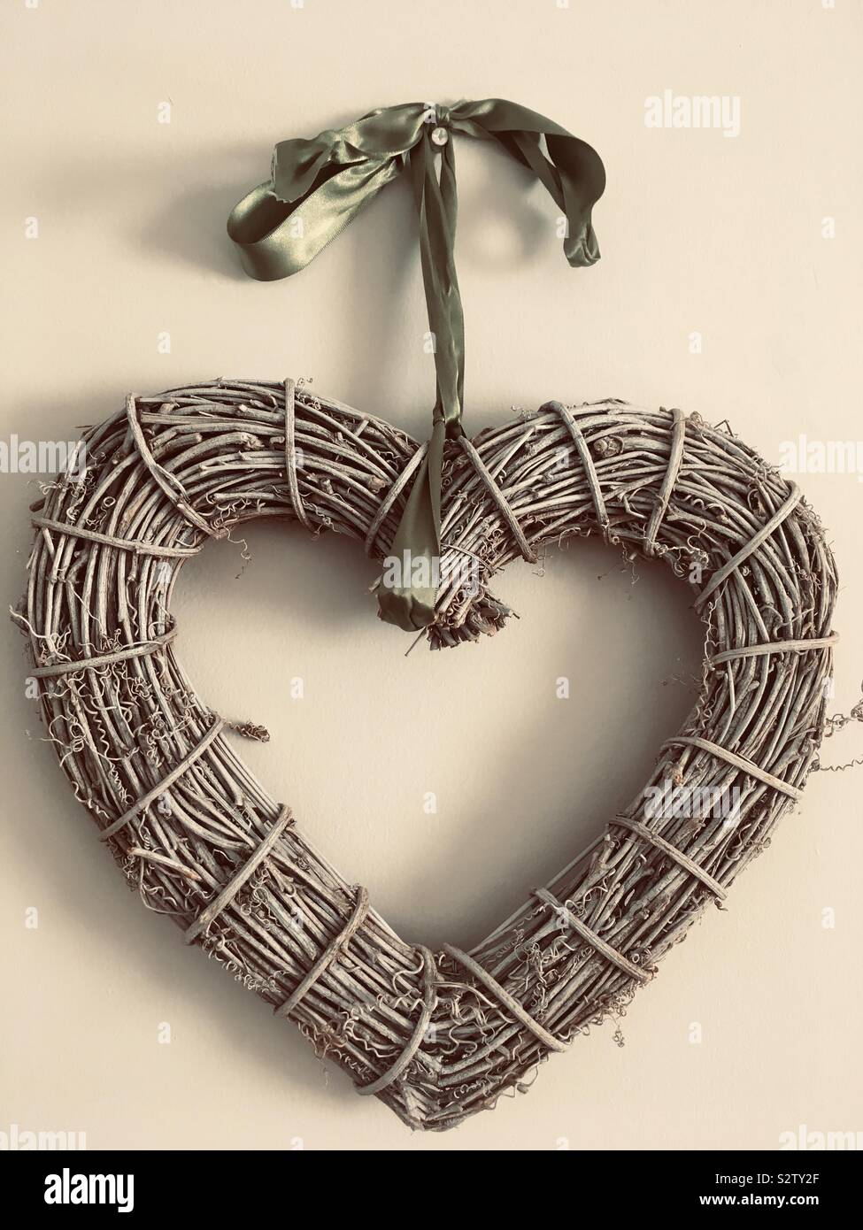 Romantic wicker heart with ribbon Stock Photo - Alamy