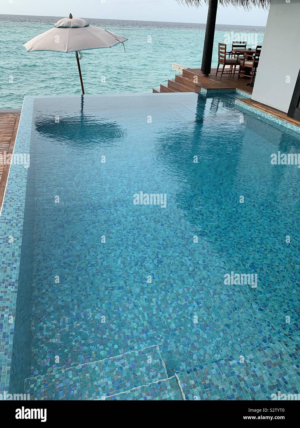 Swimming pool with ocean view Stock Photo - Alamy