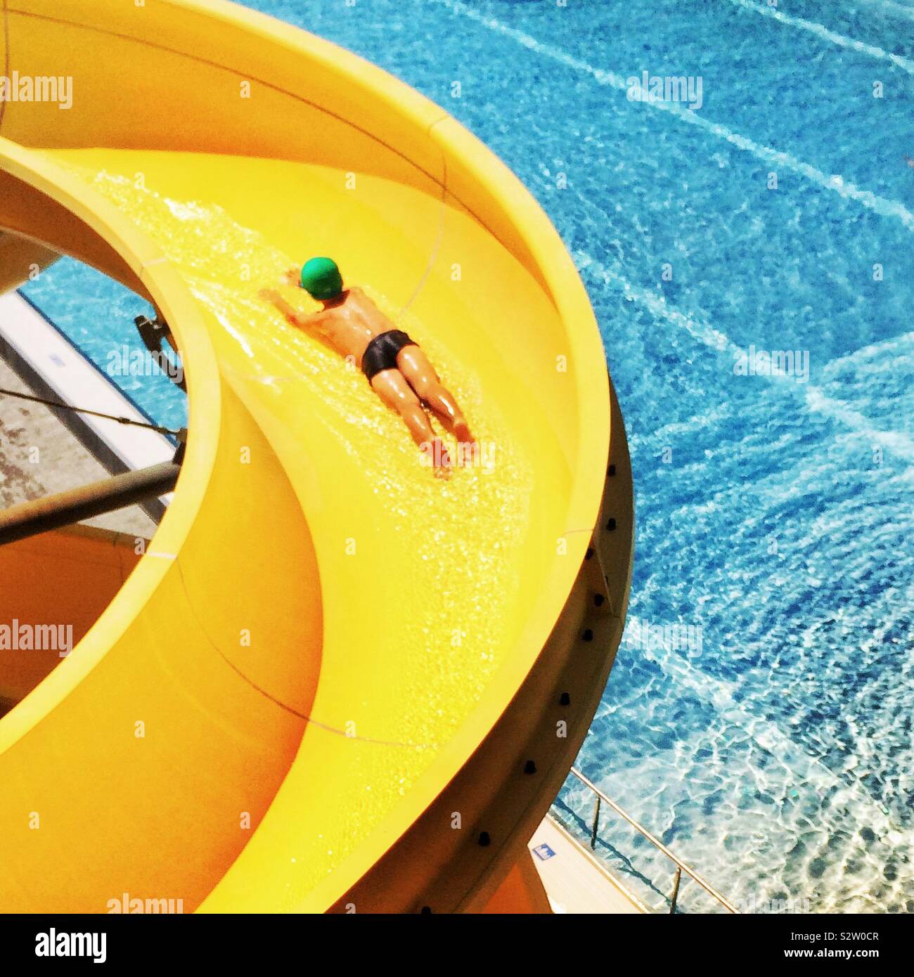 Boy riding down the water slide in Germany Stock Photo - Alamy