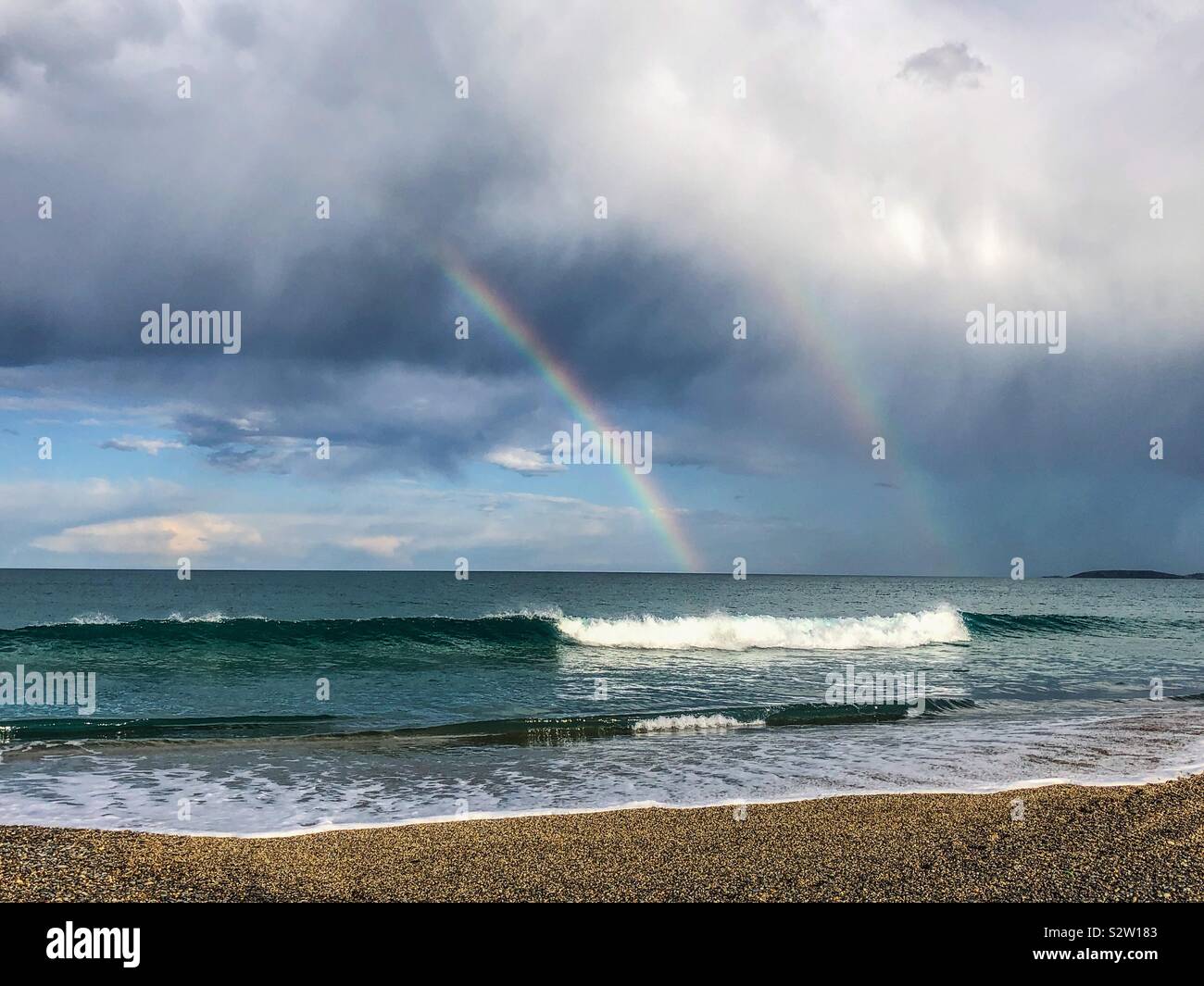 Rainbow waves at Coffs Harbour Stock Photo - Alamy