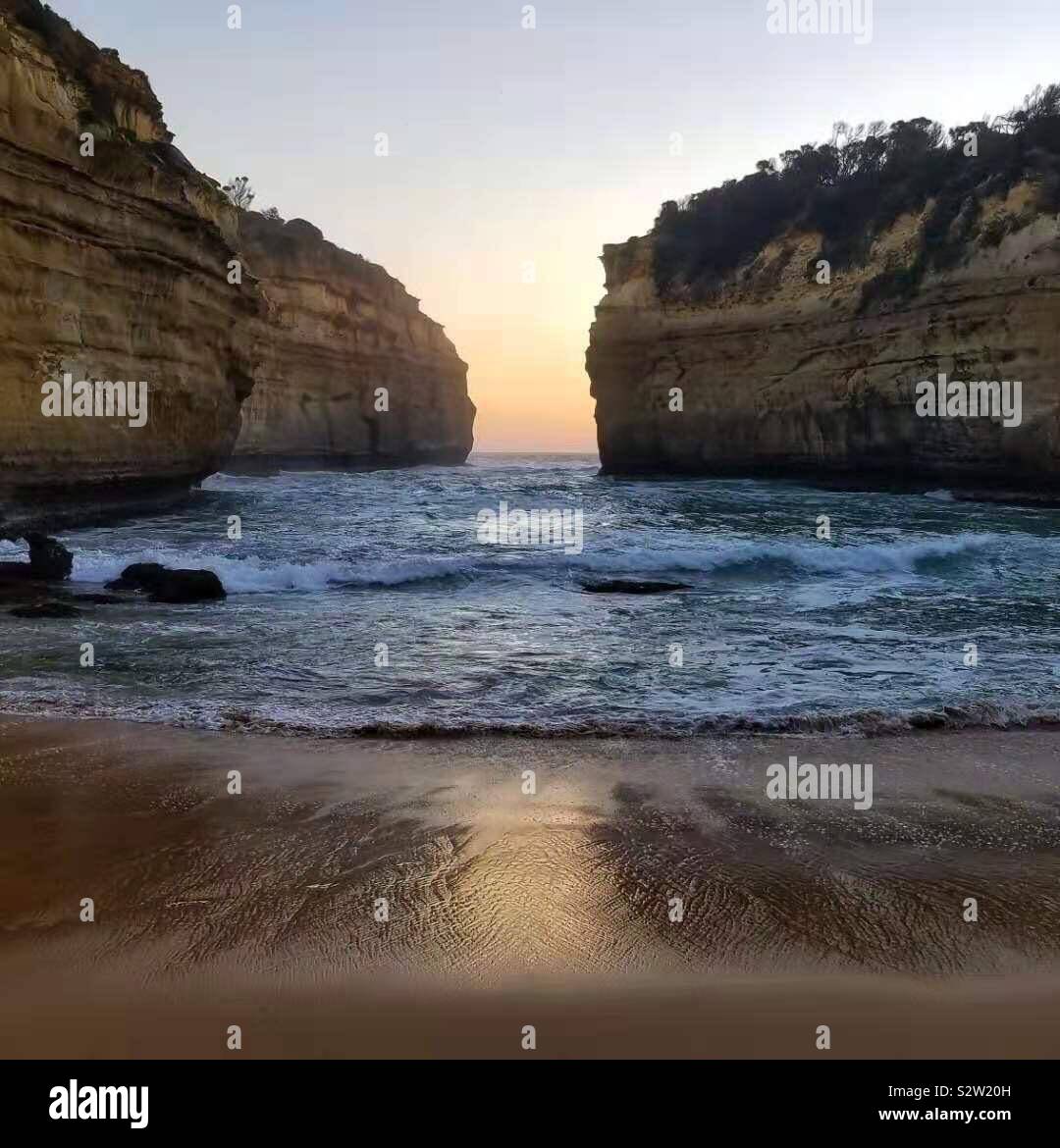 Beach between mountains Stock Photo - Alamy