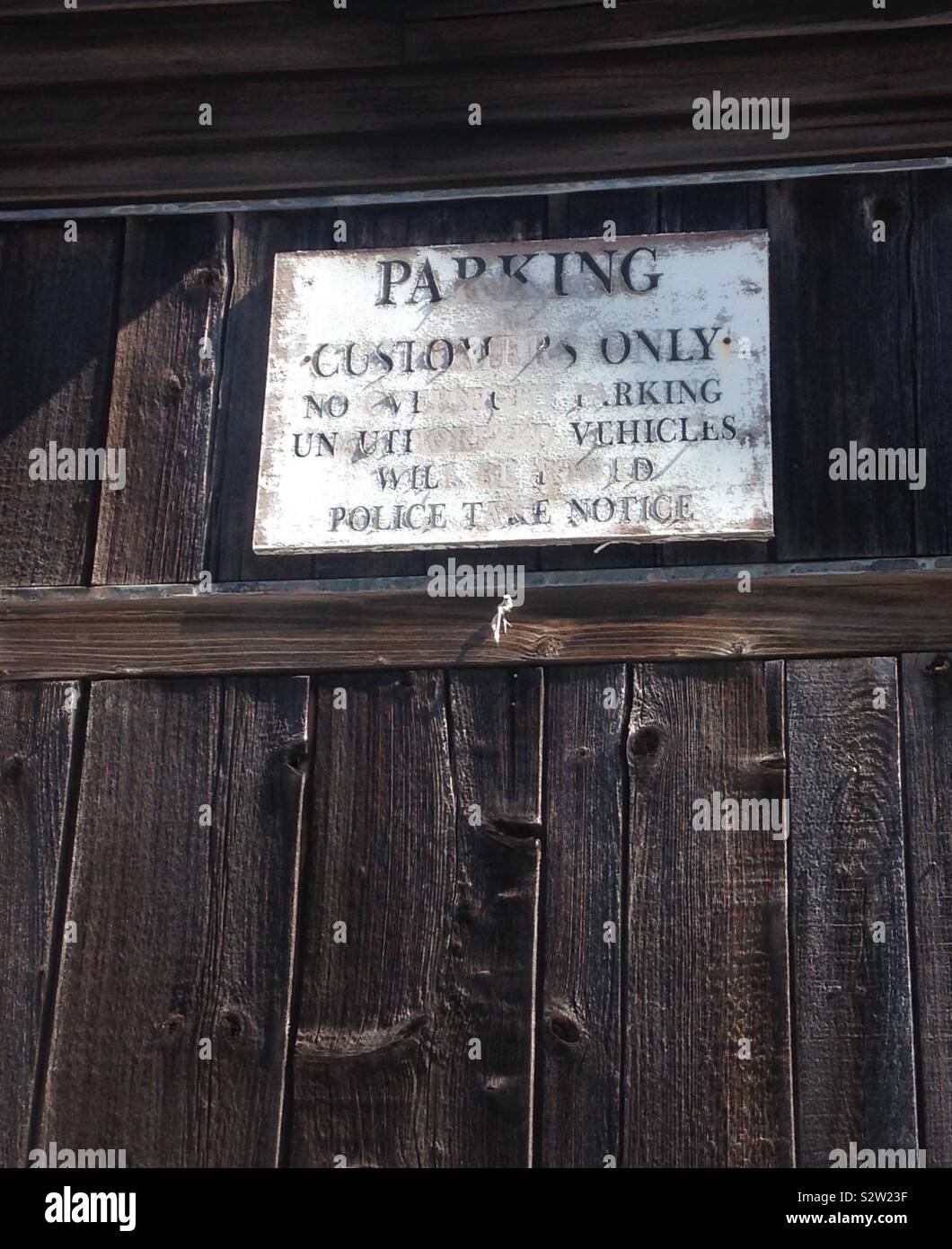 Parking Sign on barn Stock Photo - Alamy