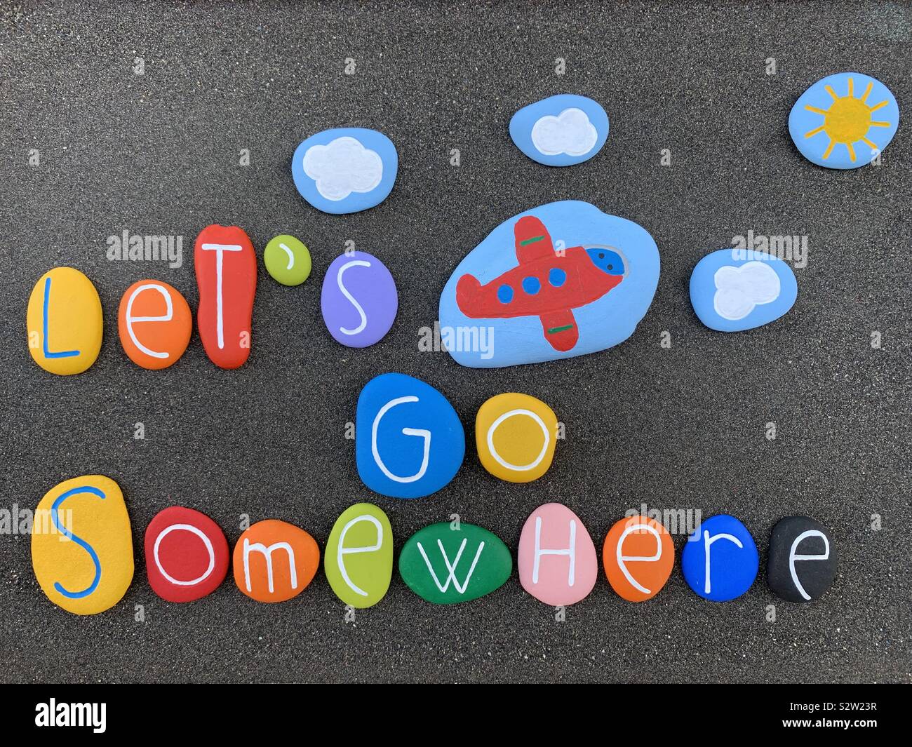 Let’s go somewhere, motivational trip slogan composed with colored ...