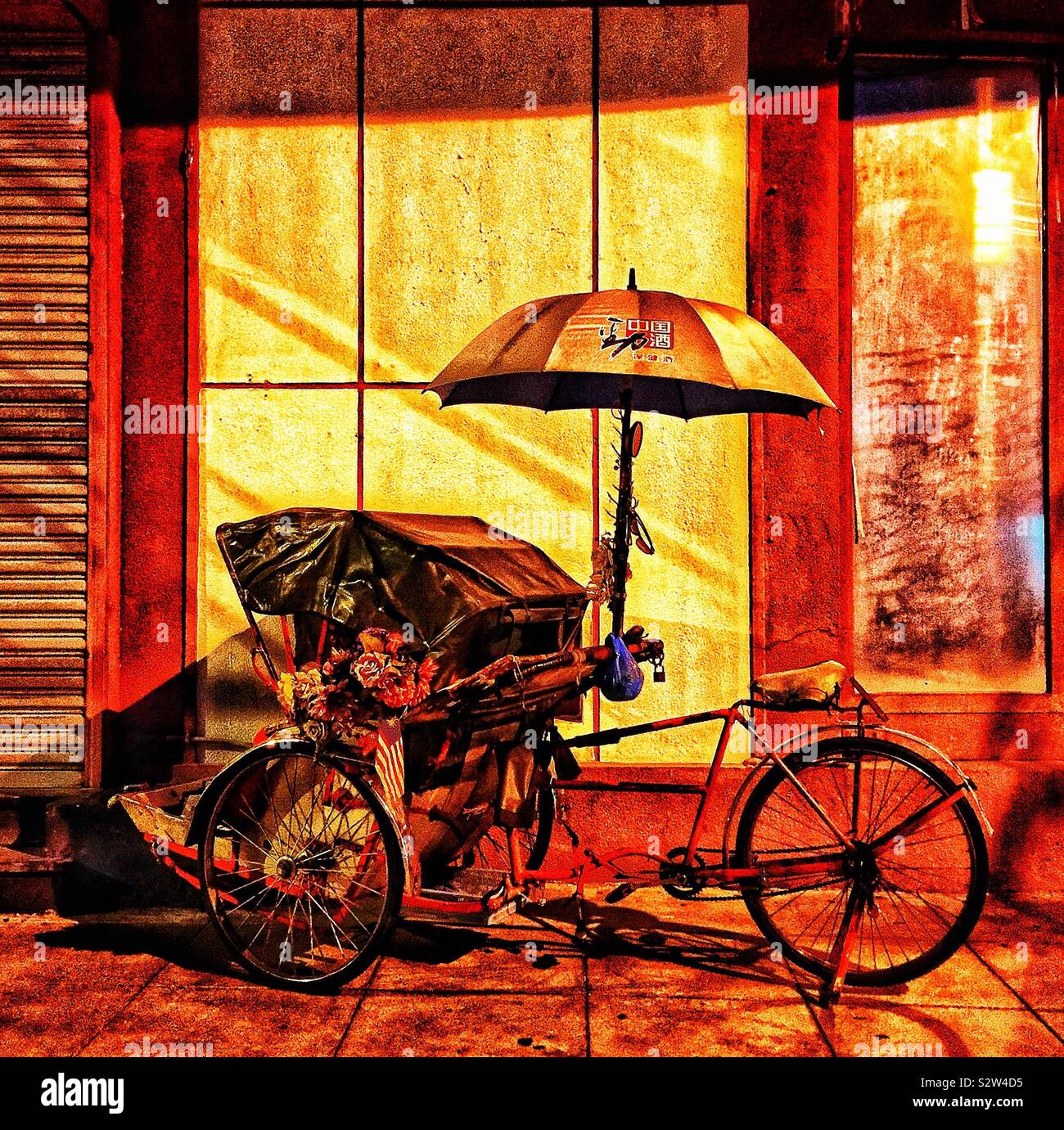 A trishaw, known locally as a 'beca', parked at night in the Old Town ...