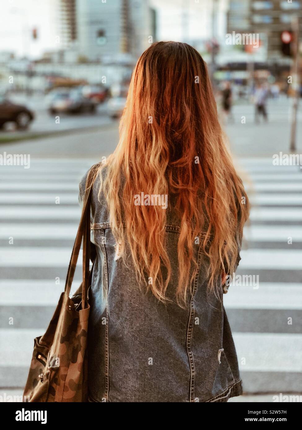 Girl waiting for green light on pedestrian crossing Stock Photo - Alamy