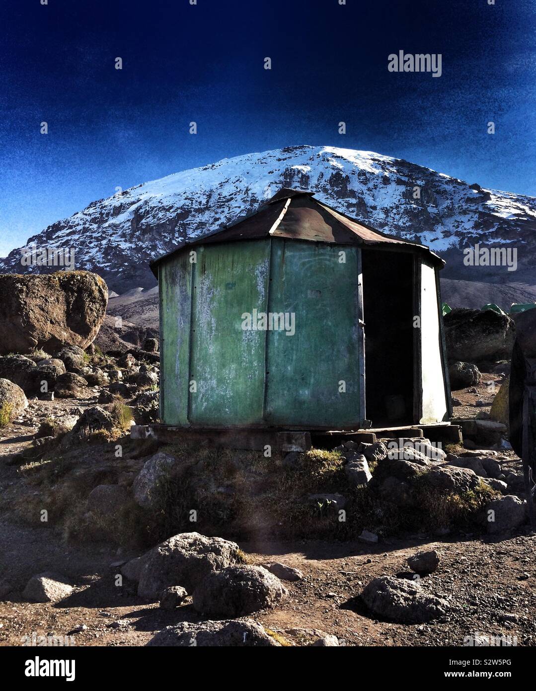 Green tin hut on slopes of Kilimanjaro Stock Photo - Alamy
