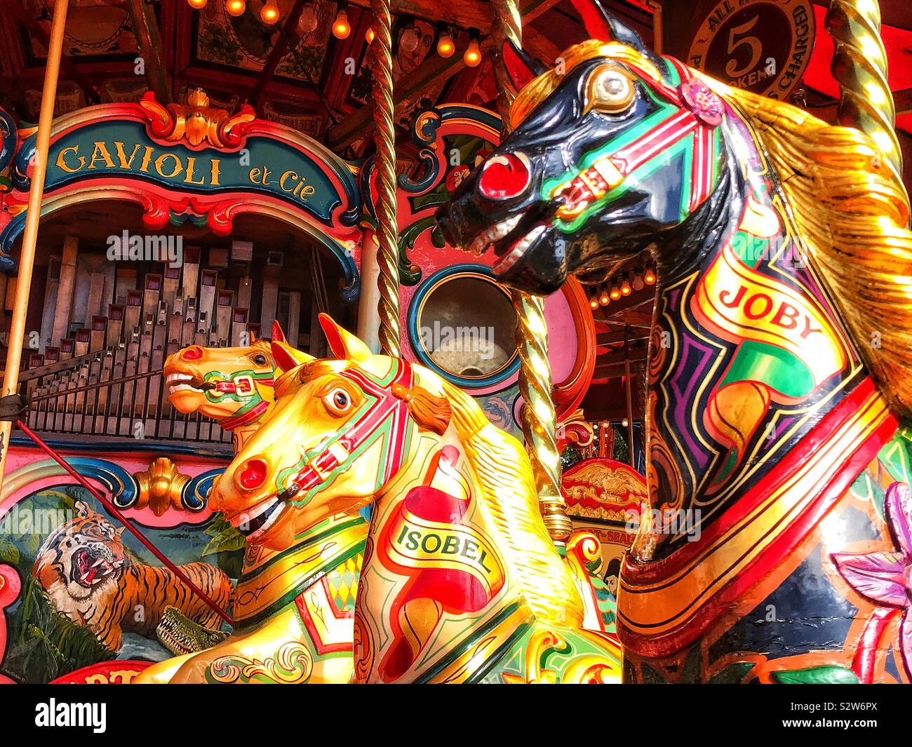 Close up of colourful fairground carousel horses, England Stock Photo ...