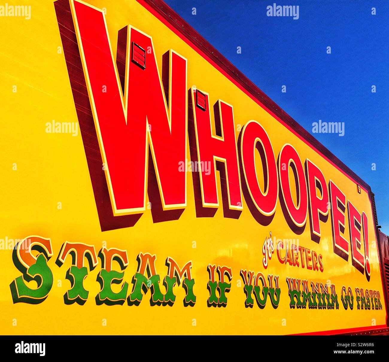 Colourful advertisement on the side of a lorry for a carnival steam ...