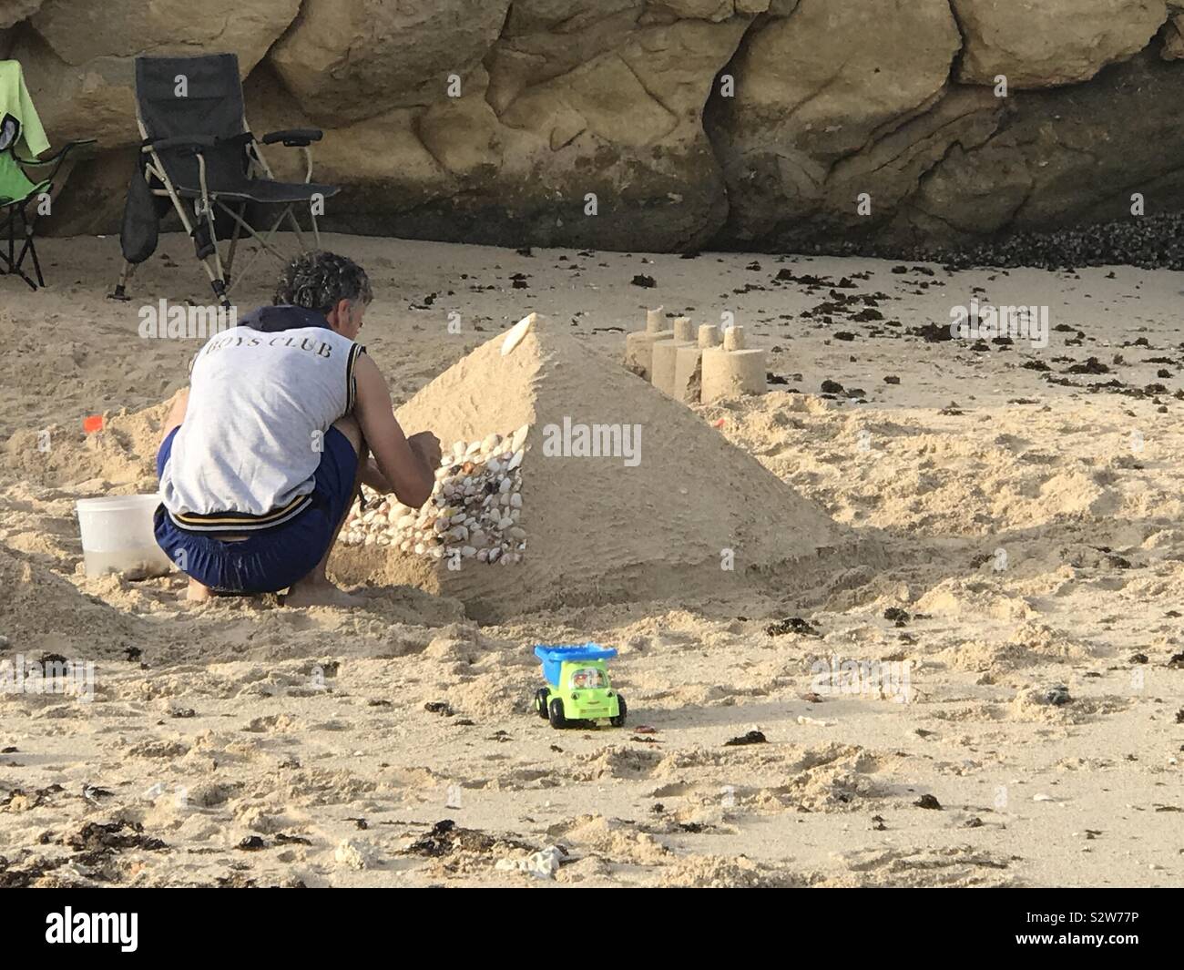 Pyramid building with sand and sea shells Stock Photo - Alamy