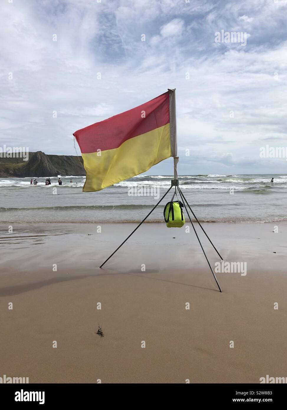 Lifeguard bathing flag fluttering on a beach Stock Photo - Alamy