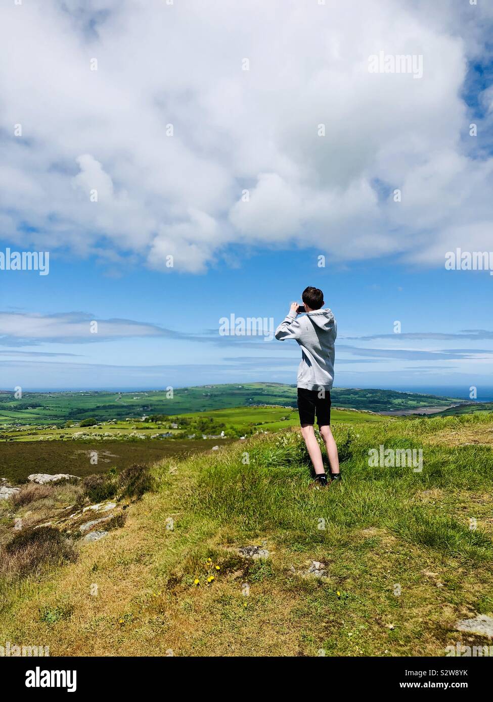 Admiring the view on Bodafon mountain Stock Photo - Alamy