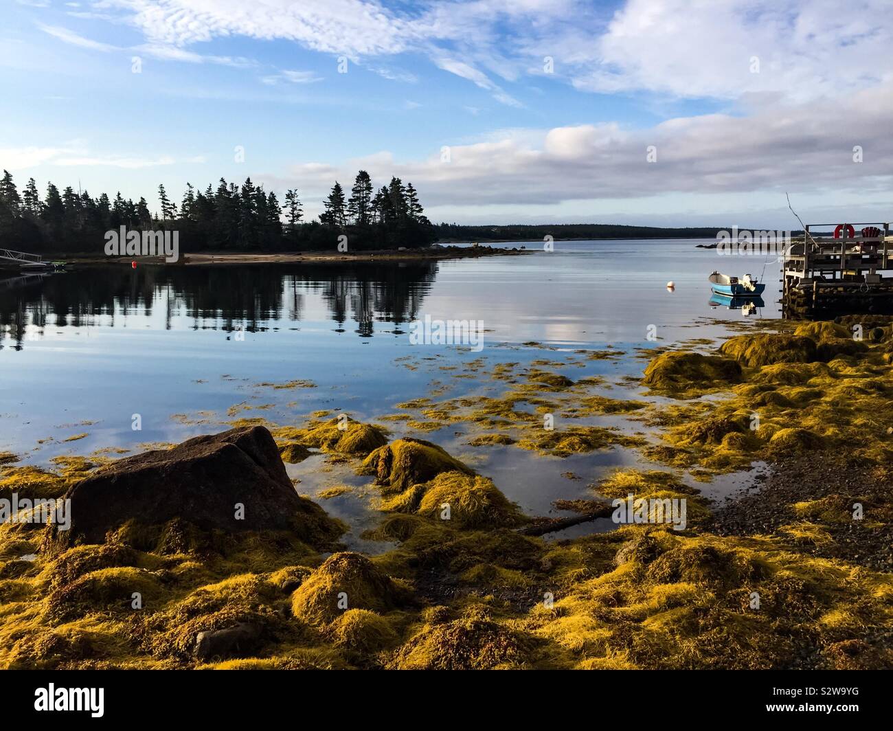 Ocean view with boat Stock Photo - Alamy