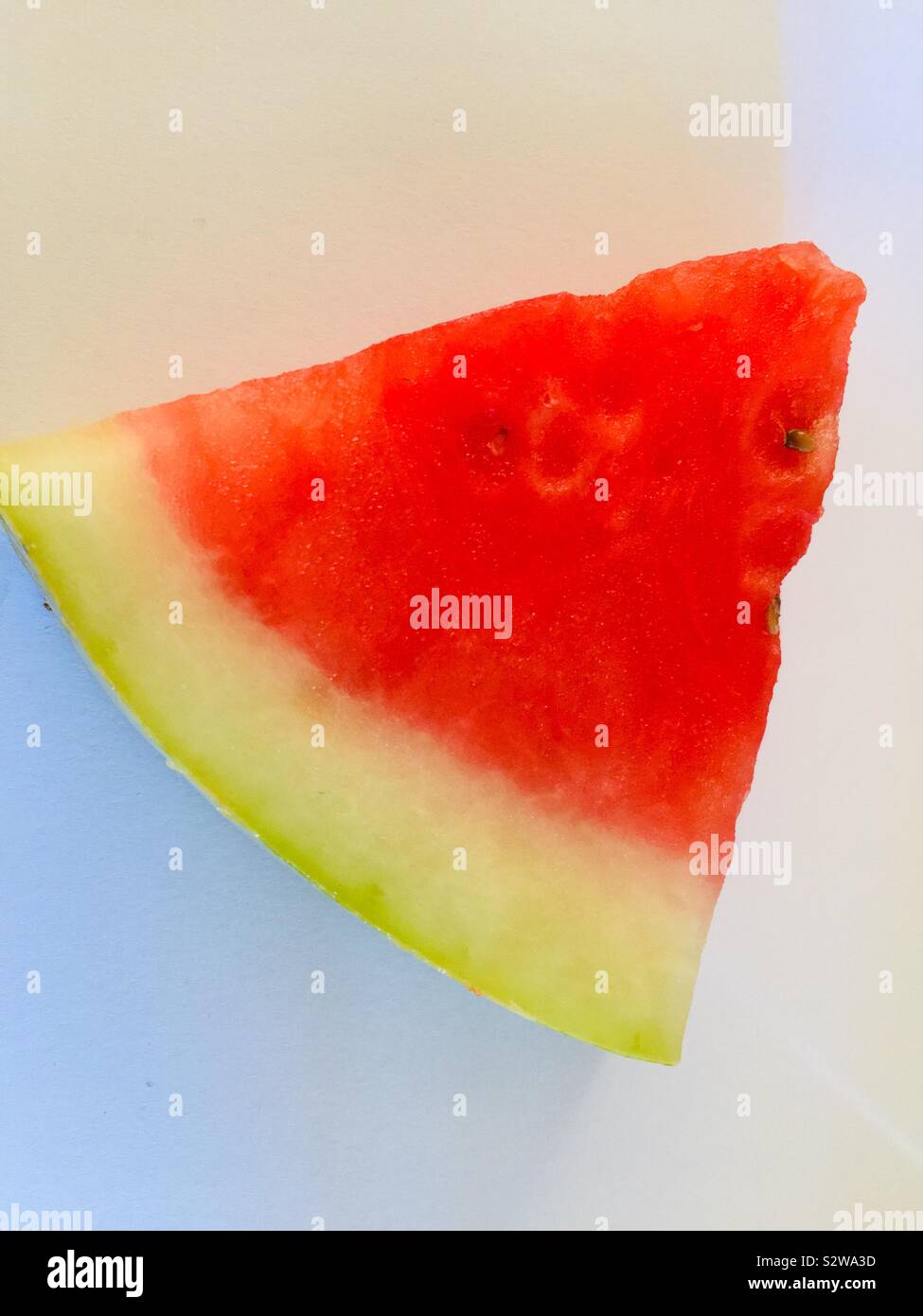 Wedge of watermelon taken in a white background. - With copy space ...