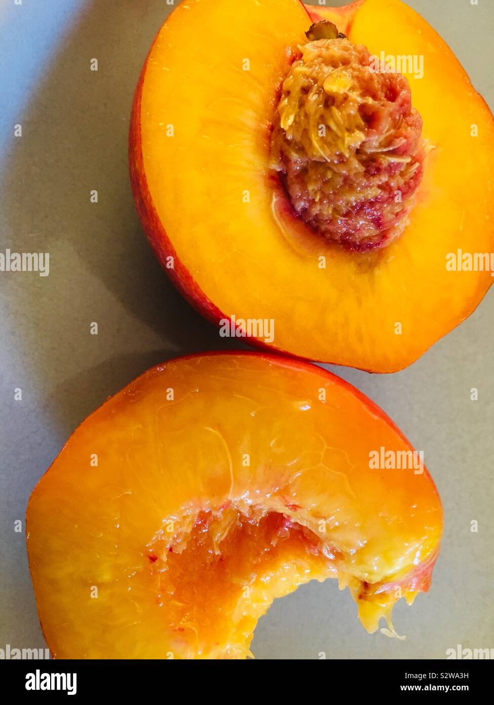 Peach with bite taken out hi-res stock photography and images - Alamy