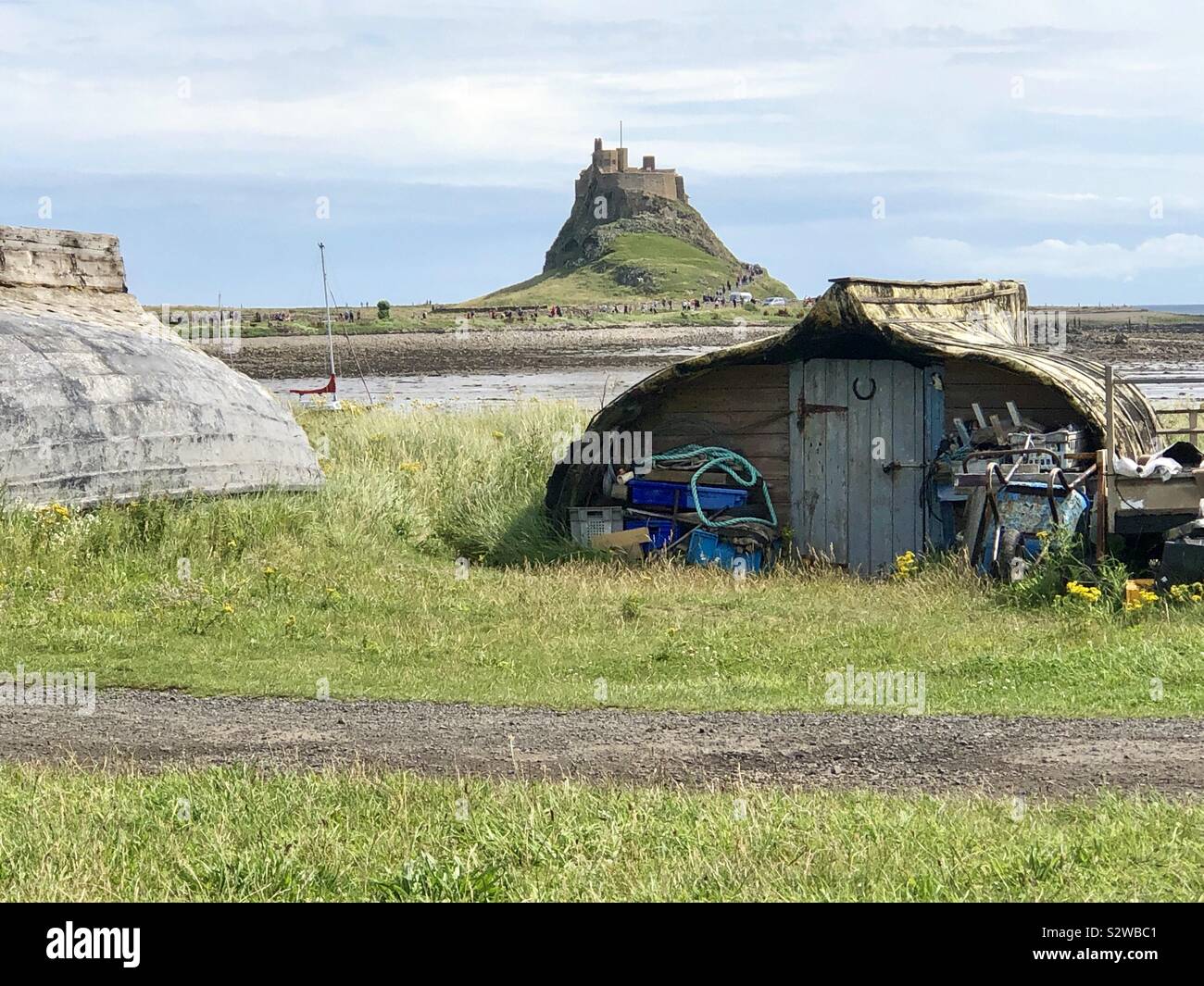 Lindisfarne and boat hut Stock Photo - Alamy