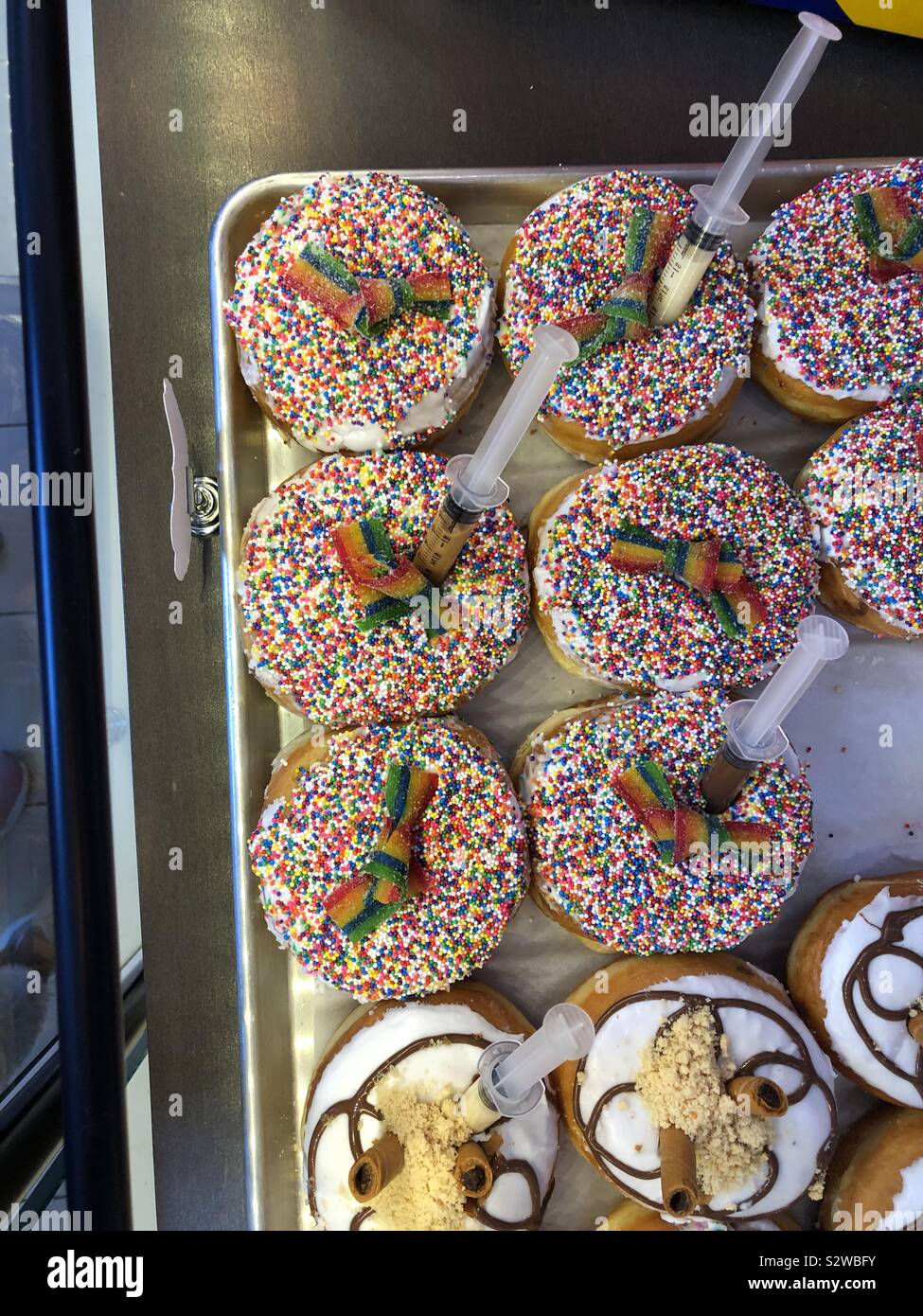 Delicious variety of Giant Donuts flavors Stock Photo - Alamy