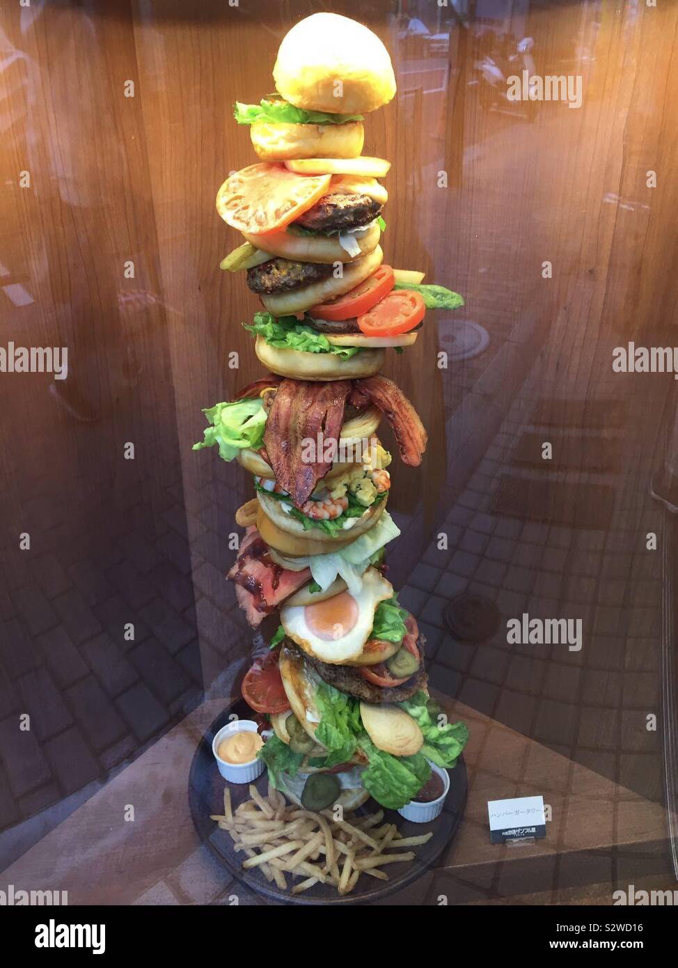Food made of plastic - piled high burger Stock Photo - Alamy