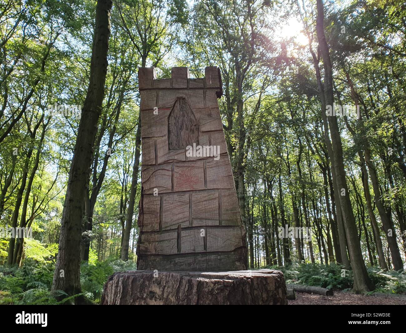 Wood castle towerade from tree stump Stock Photo - Alamy