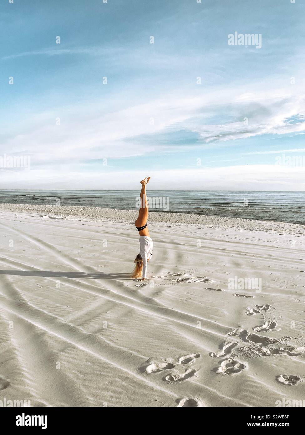 Handstands on the beach Stock Photo - Alamy