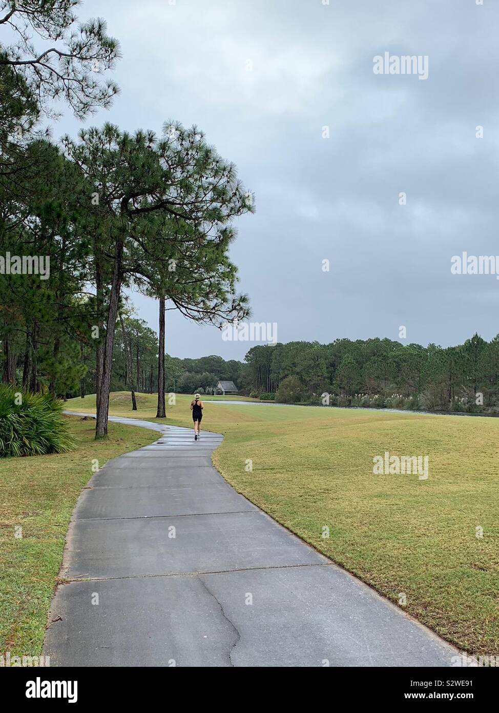 Running on a cloudy and rainy day Stock Photo - Alamy