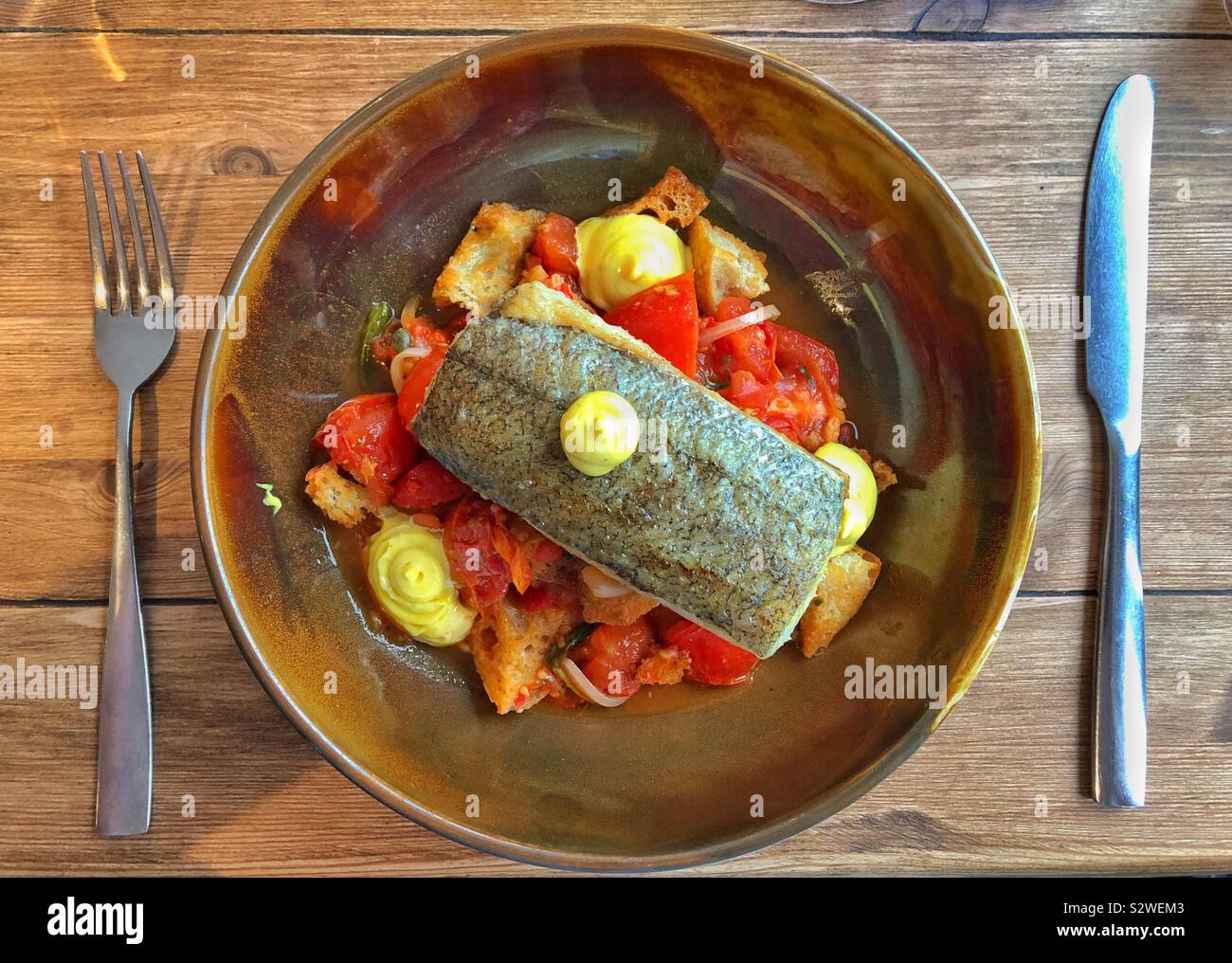 Salted Hake with Panzanella salad and saffron aioli Stock Photo - Alamy