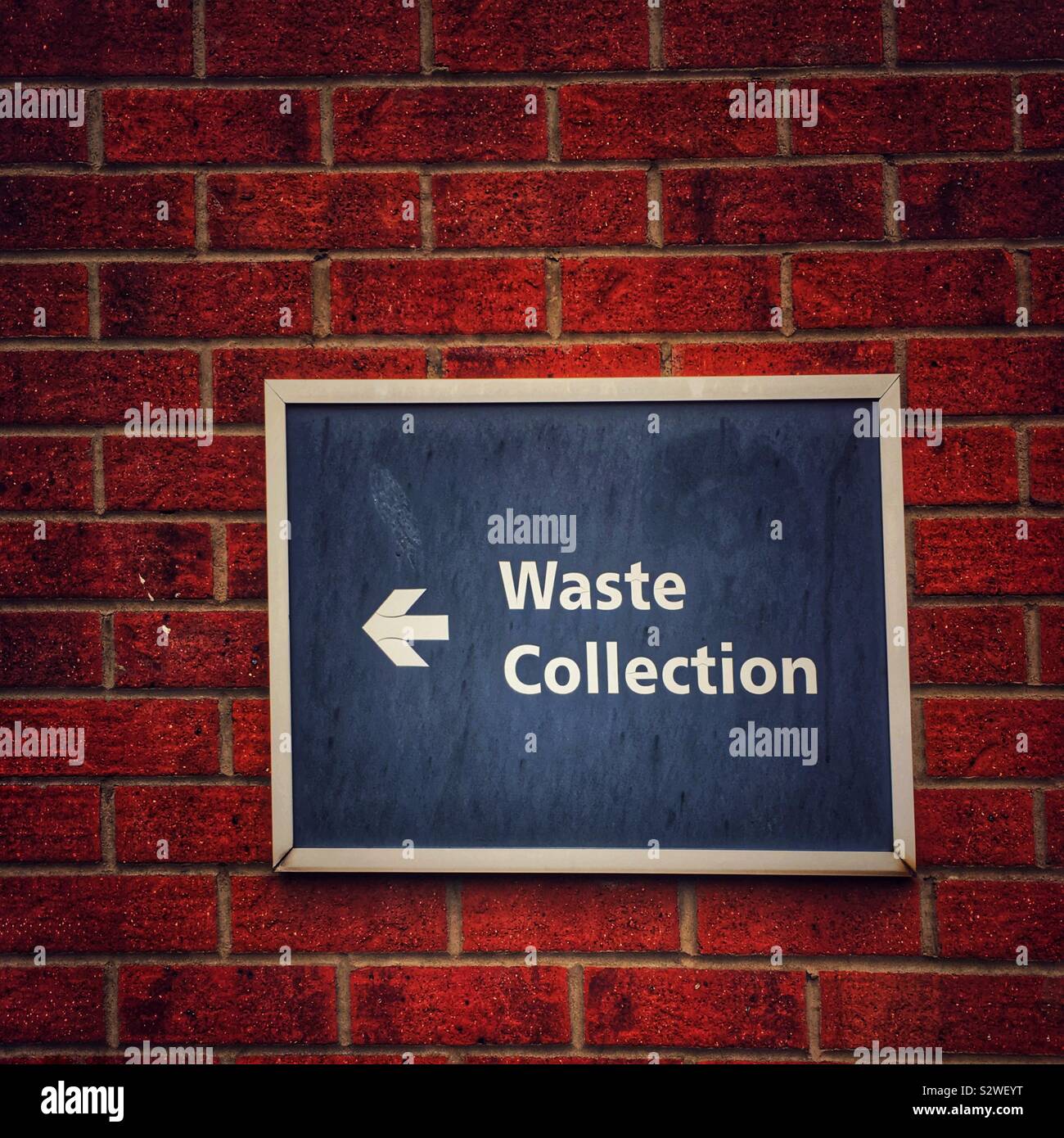Arrow pointing to waste collection Stock Photo - Alamy