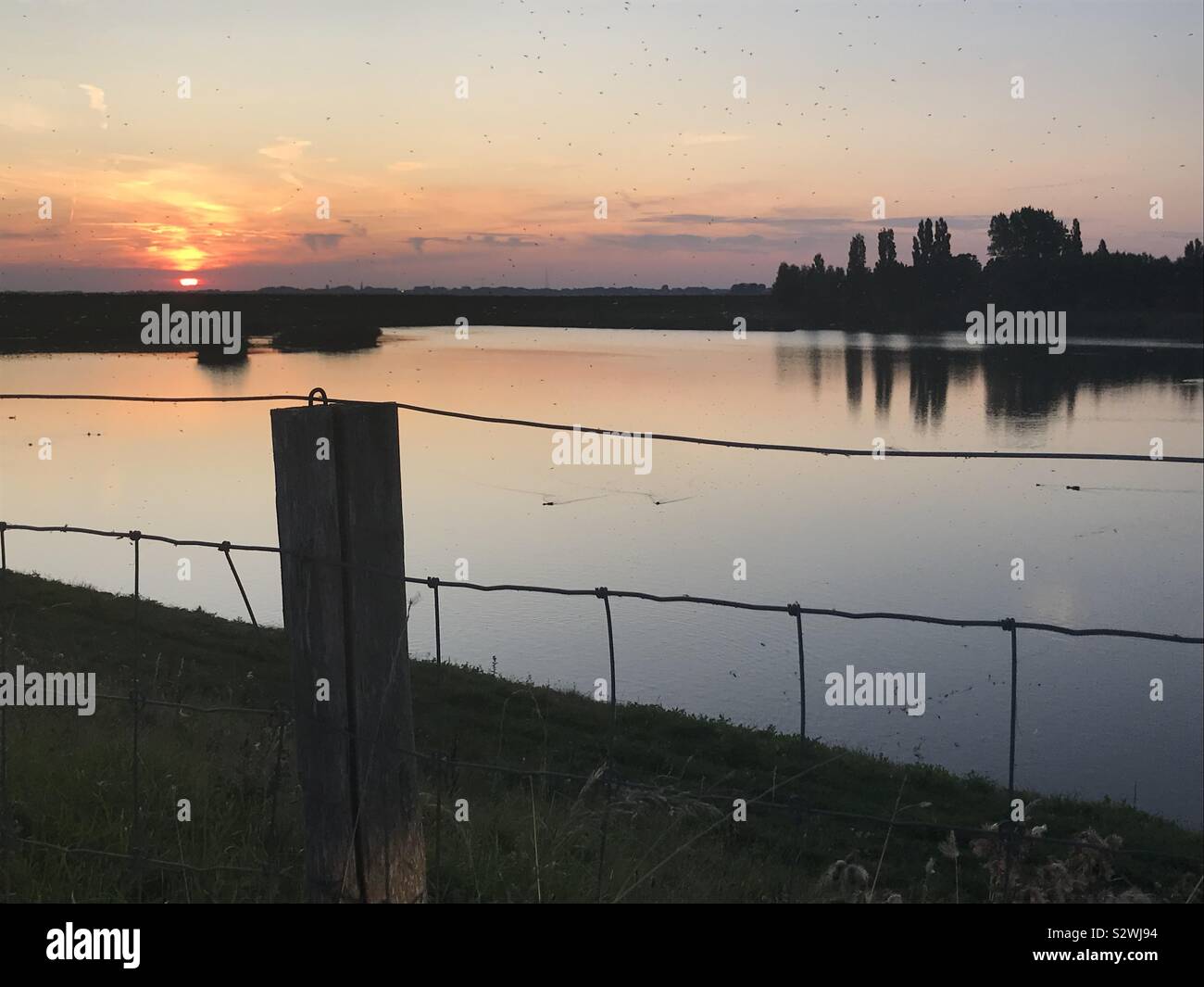 After swimming the sun went down Stock Photo - Alamy