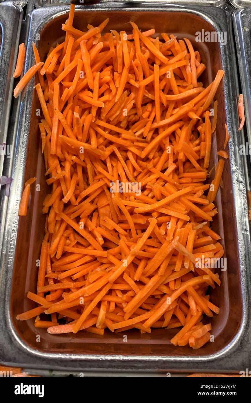 Slivered carrots served buffet style Stock Photo - Alamy
