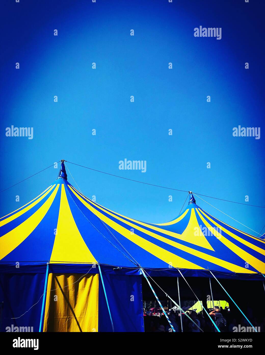 Circus tents. Blue and yellow with blue skies Stock Photo - Alamy