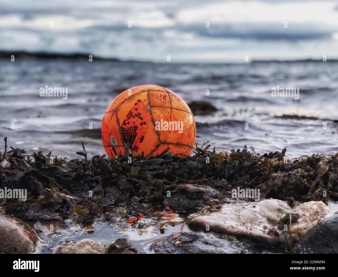 Football washed up Stock Photo - Alamy