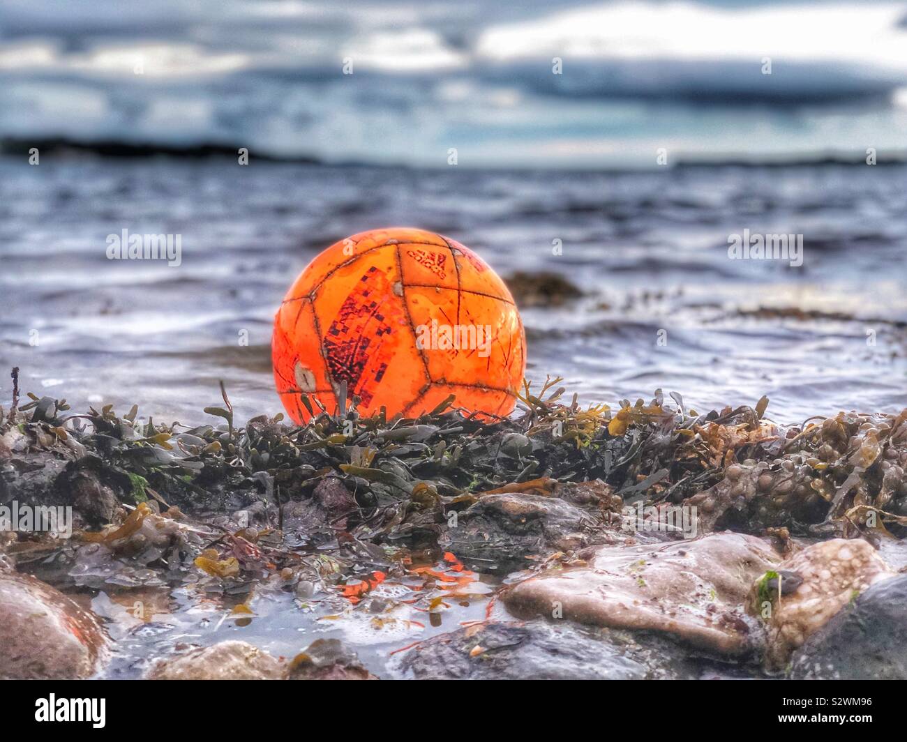 Football washed up Stock Photo - Alamy