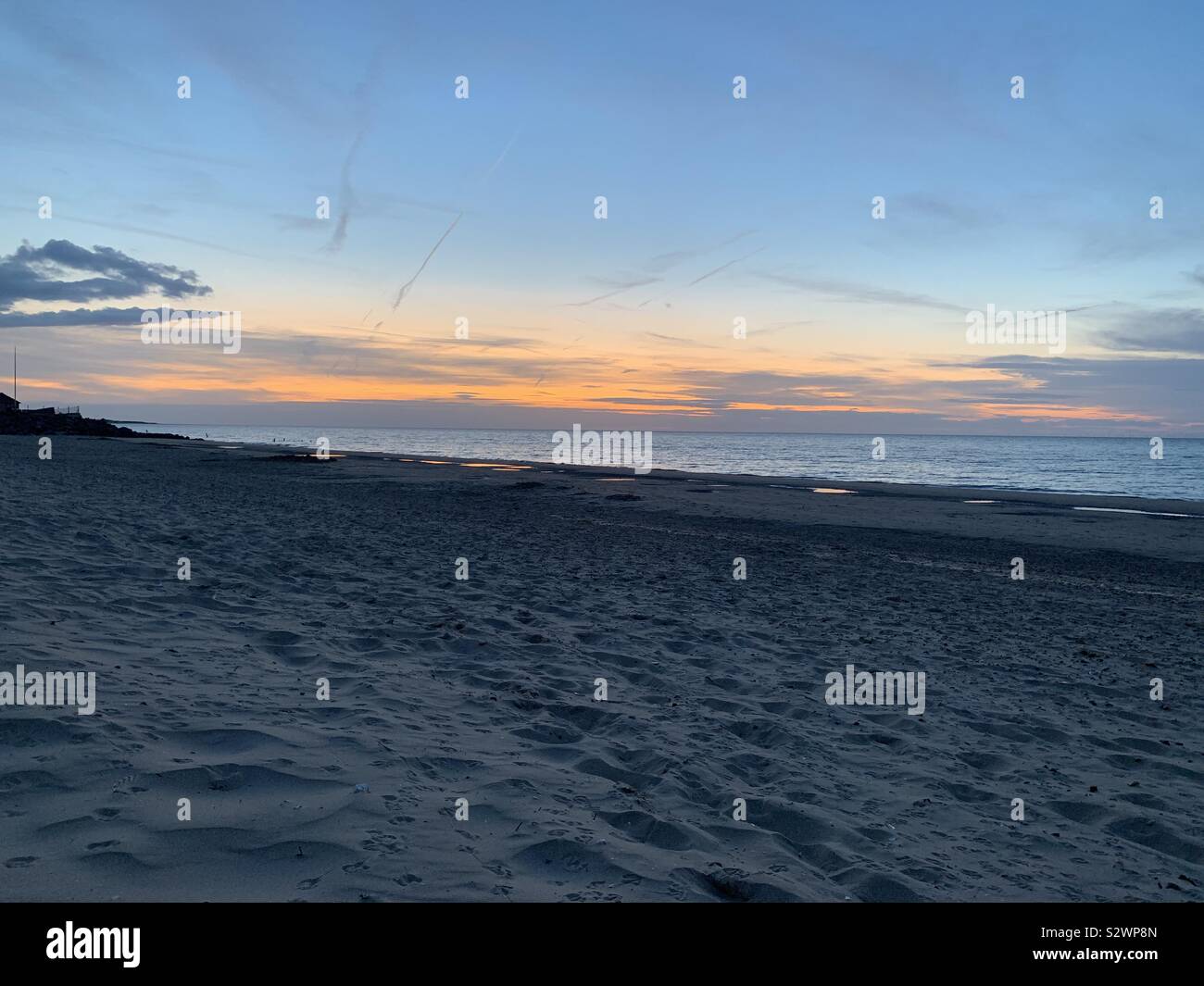 Sun set at the beach Stock Photo - Alamy