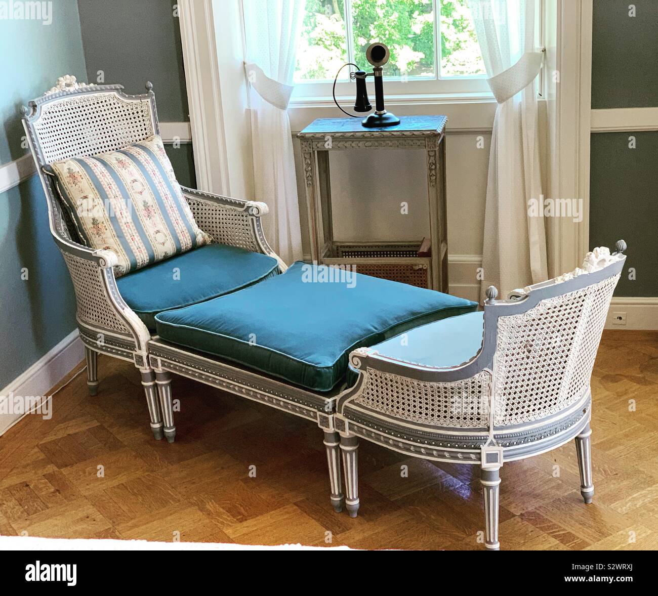 A chaise lounge and telephone by a window at the Mount, the estate ...