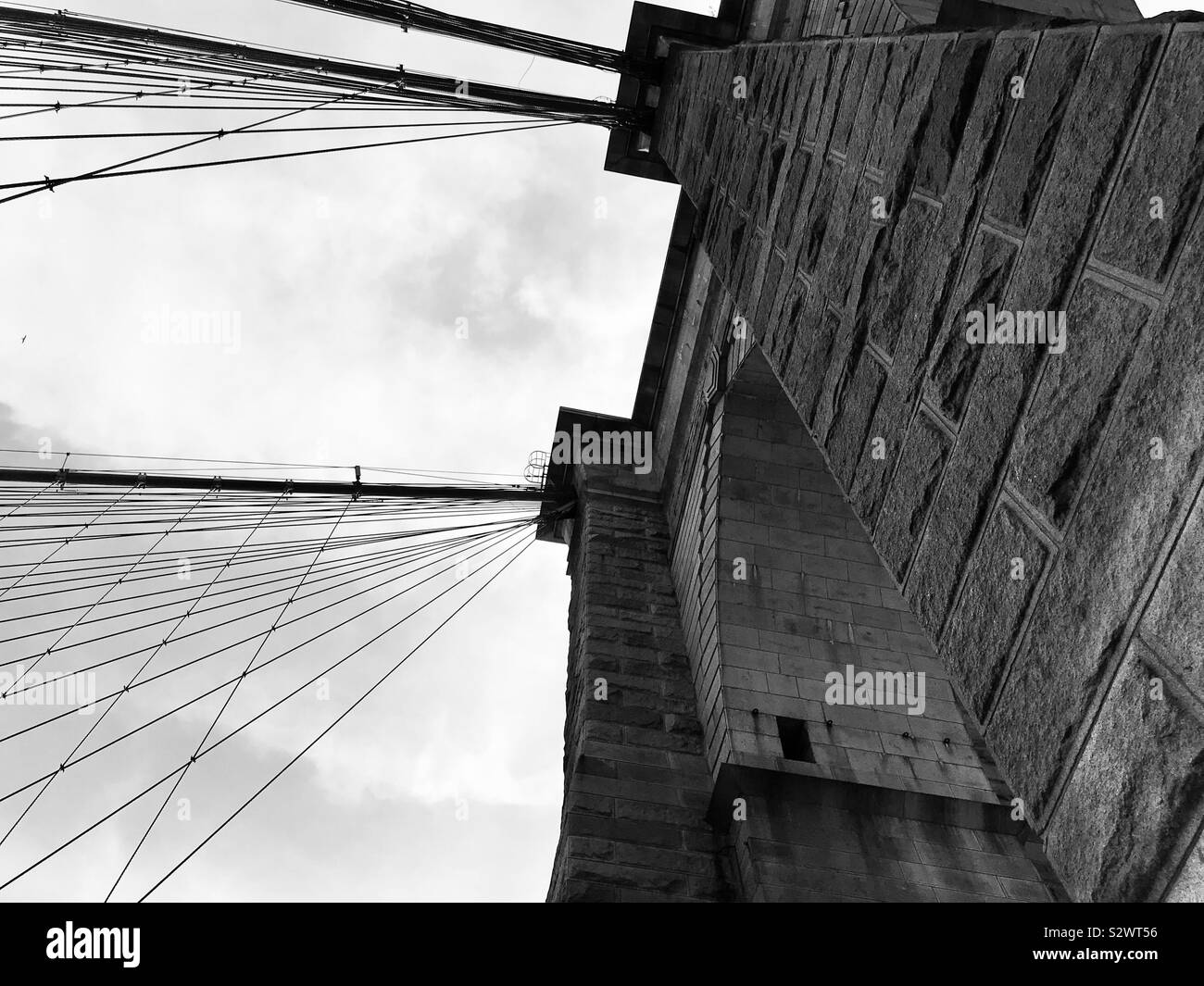 Sky over Brooklyn Bridge stone pillars - New York Stock Photo - Alamy