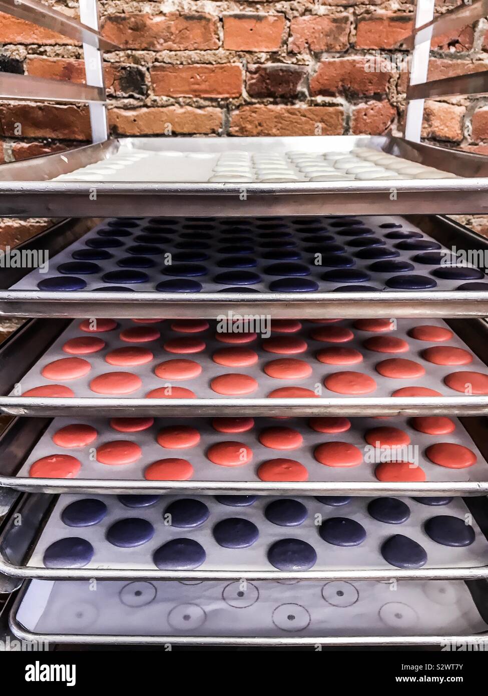 Macarons waiting on a rack Stock Photo - Alamy