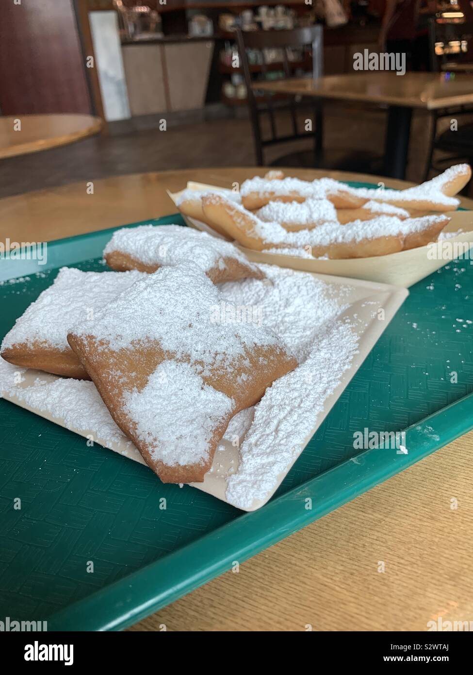 Finger beignets and triangle beignets Stock Photo - Alamy