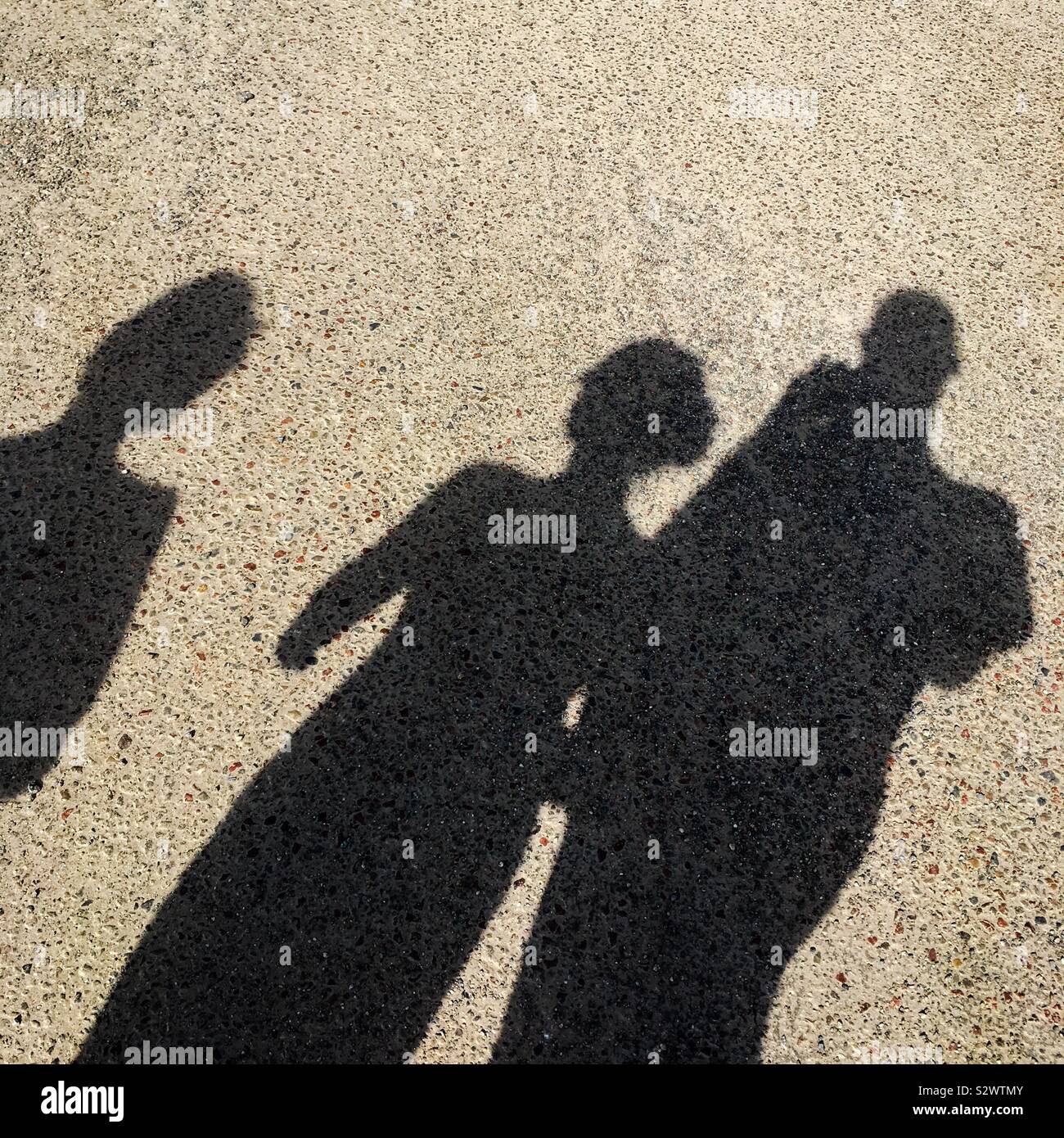 Shadows cast people walking hi-res stock photography and images - Alamy