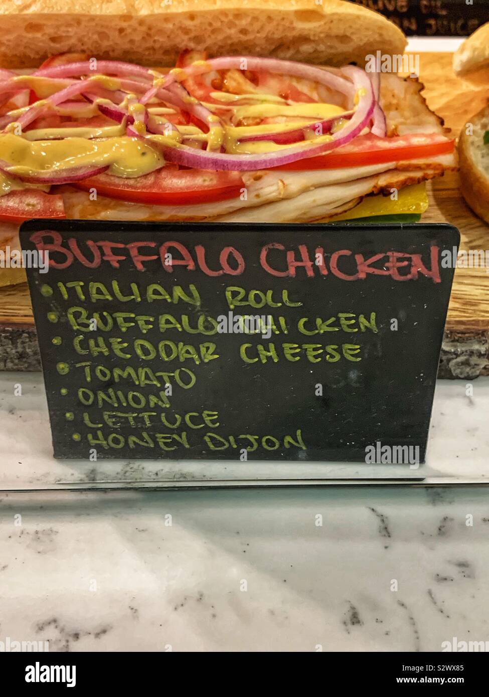 Buffalo chicken sandwich with Italian roll, buffalo chicken, cheddar ...