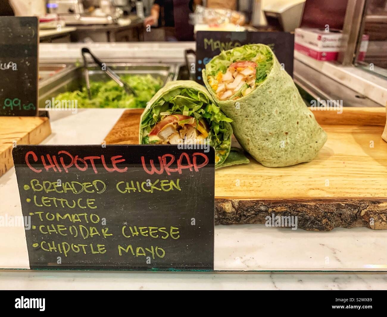 Chipotle wrap with breaded chicken, lettuce, tomato, cheddar cheese ...