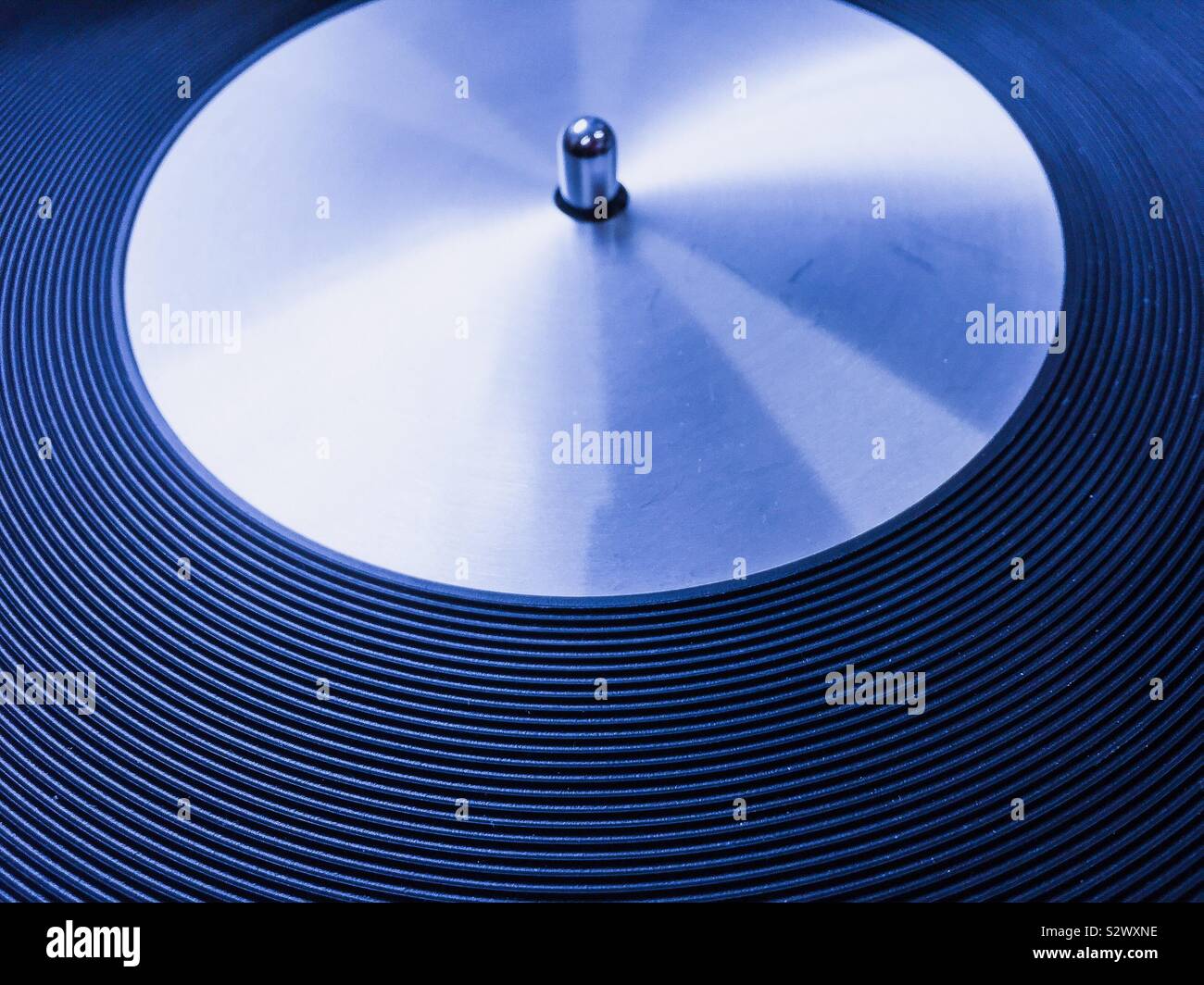Close up vinyl record in blue Stock Photo - Alamy