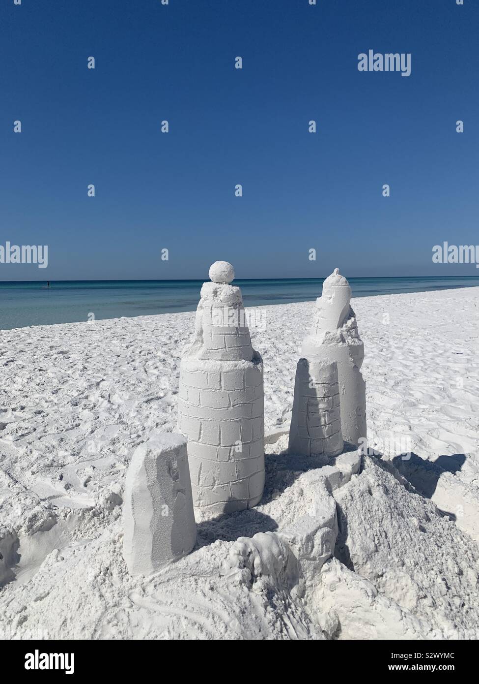 Medium size sandcastle towers on white sand beach in Florida with view ...