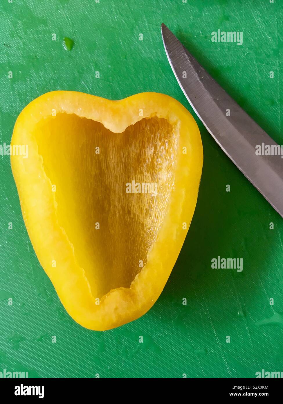 Yellow pepper heart Stock Photo - Alamy