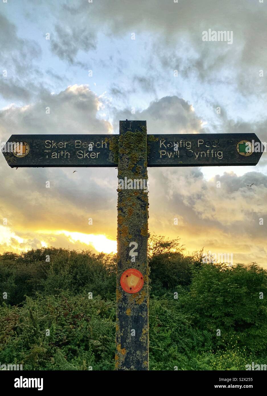 Sign post to Kenfig Pool and Sker beach in Kenfig Nature Reserve South ...
